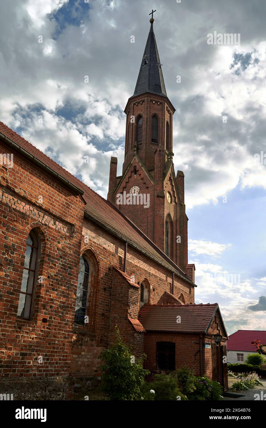 Historic church with a red brick bell tower in Lubniewice, Poland Stock ...