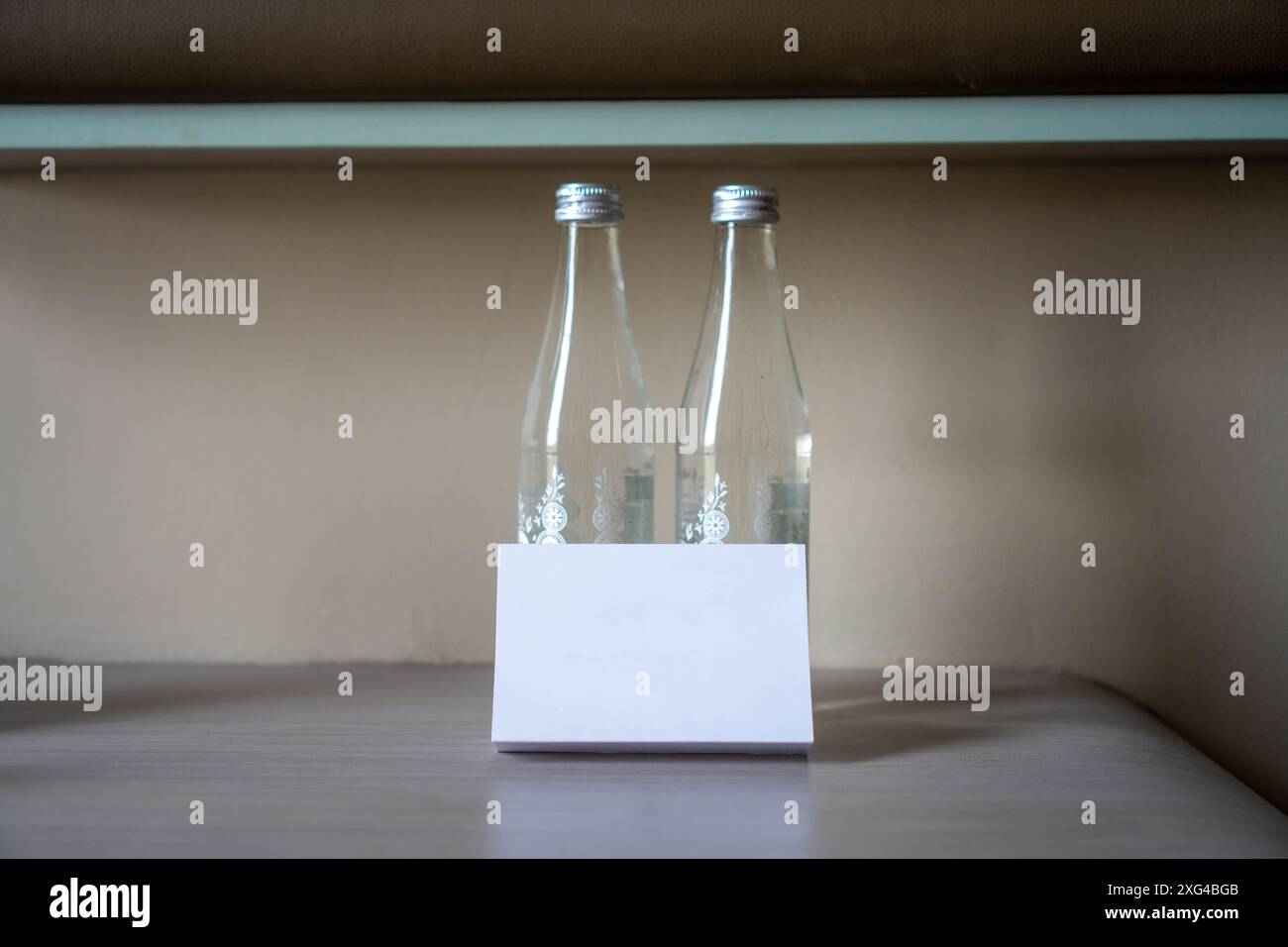 Hotel room services. Two bottles of mineral water in the hotel room ...