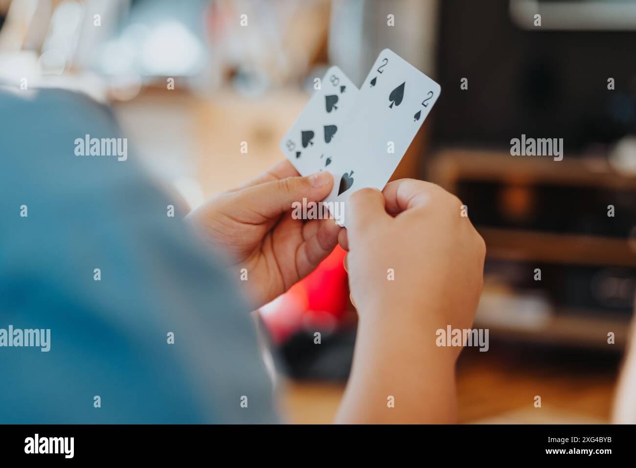 Siblings playing card game hi-res stock photography and images - Alamy