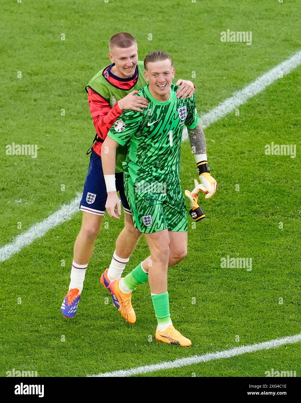 England's Adam Wharton (left) celebrates with goalkeeper Jordan ...