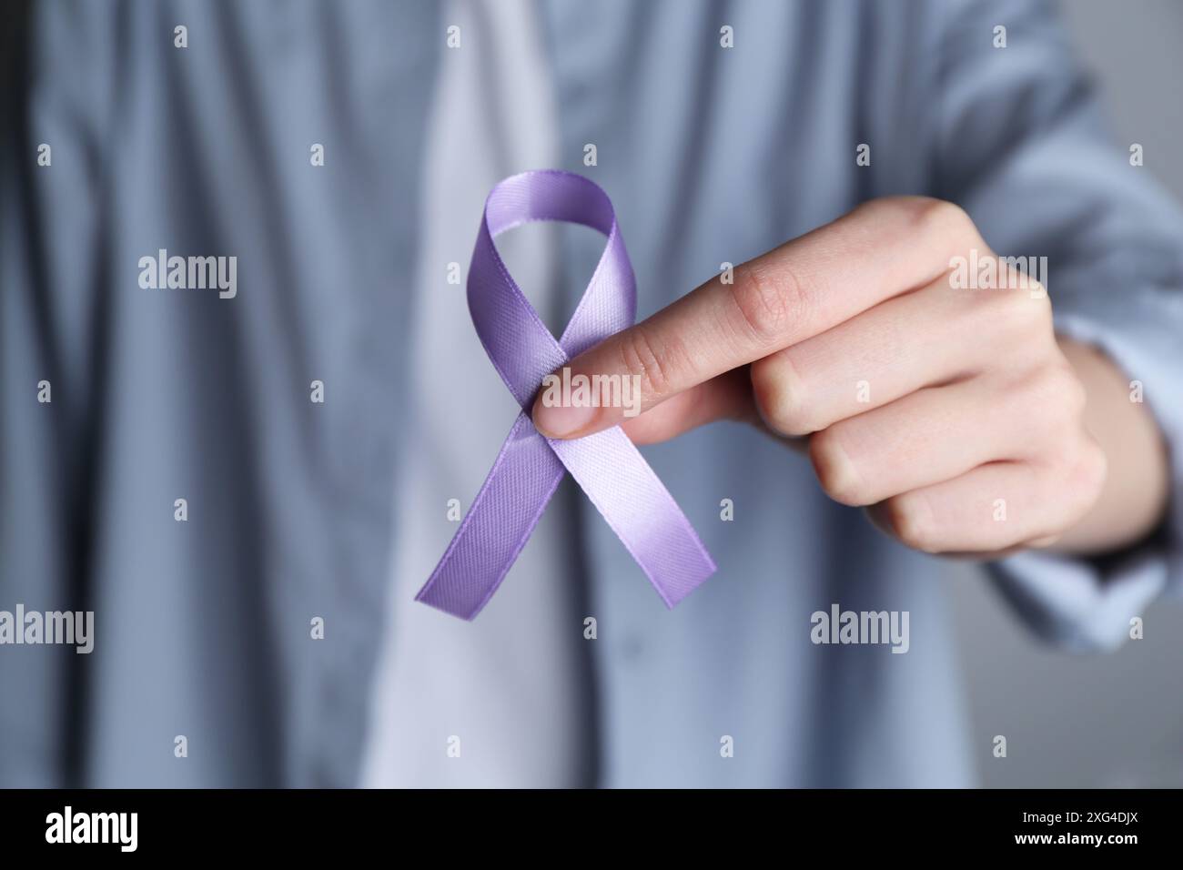 Woman violet awareness ribbon hi-res stock photography and images - Alamy
