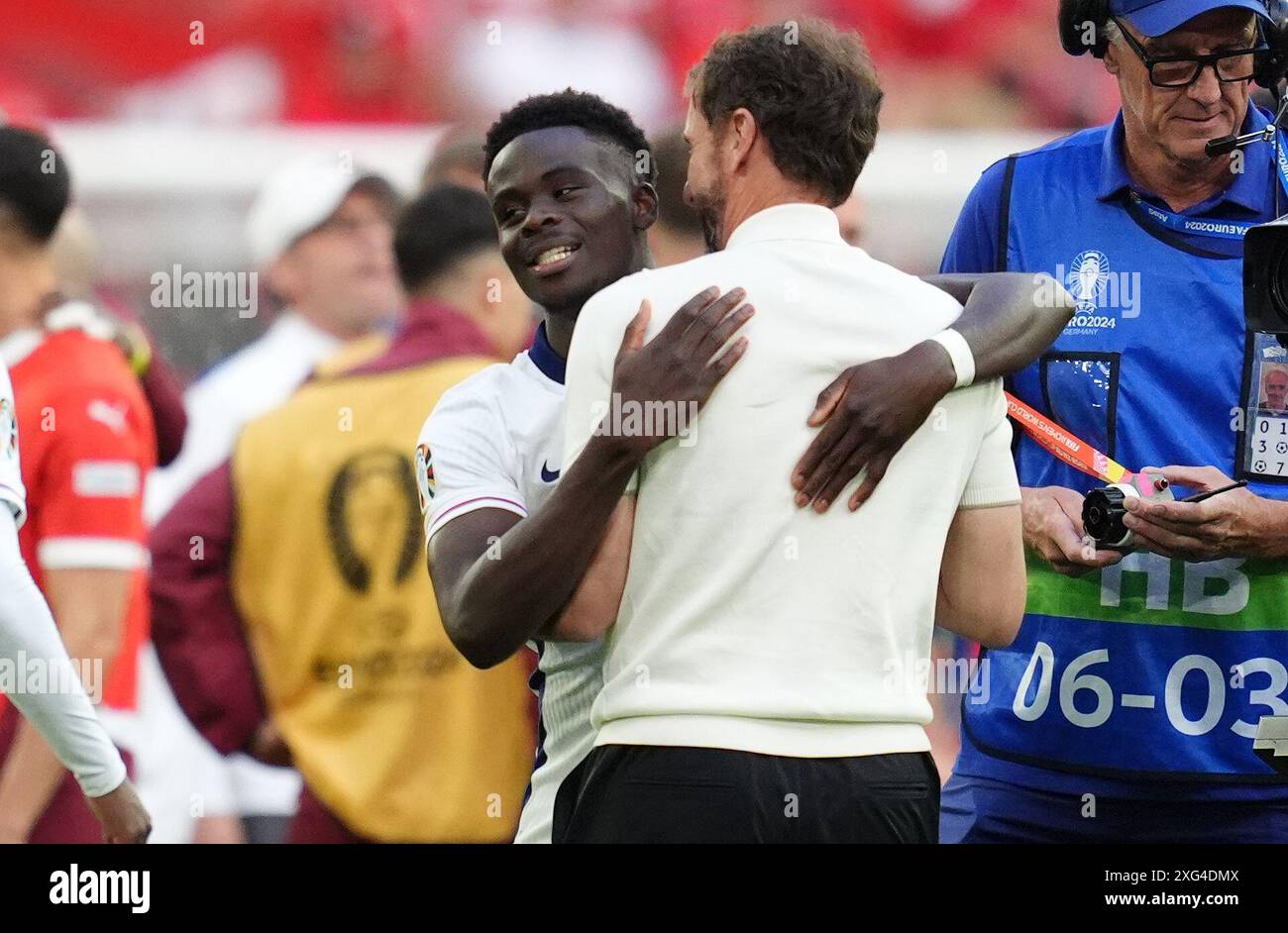 England manager Gareth Southgate and Bukayo Saka celebrate after their ...