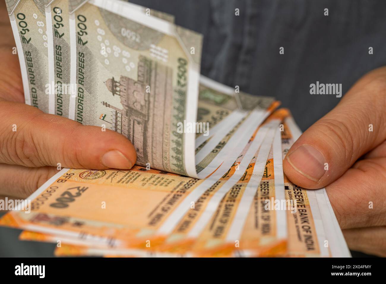 India money, Man counts Indian rupees, Close-up of hands with banknotes ...