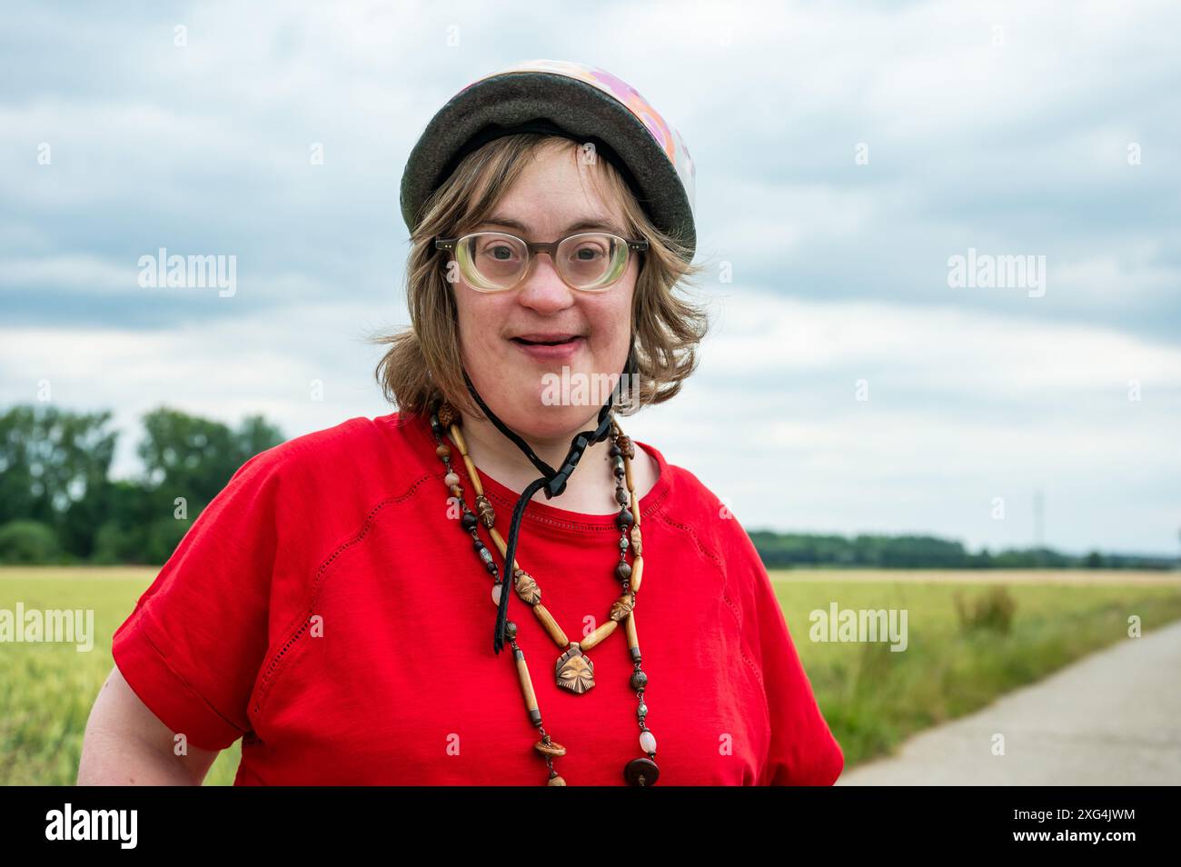 Outdoor portrait of a 41 yo girl with the Down Syndrome at the Flemish ...