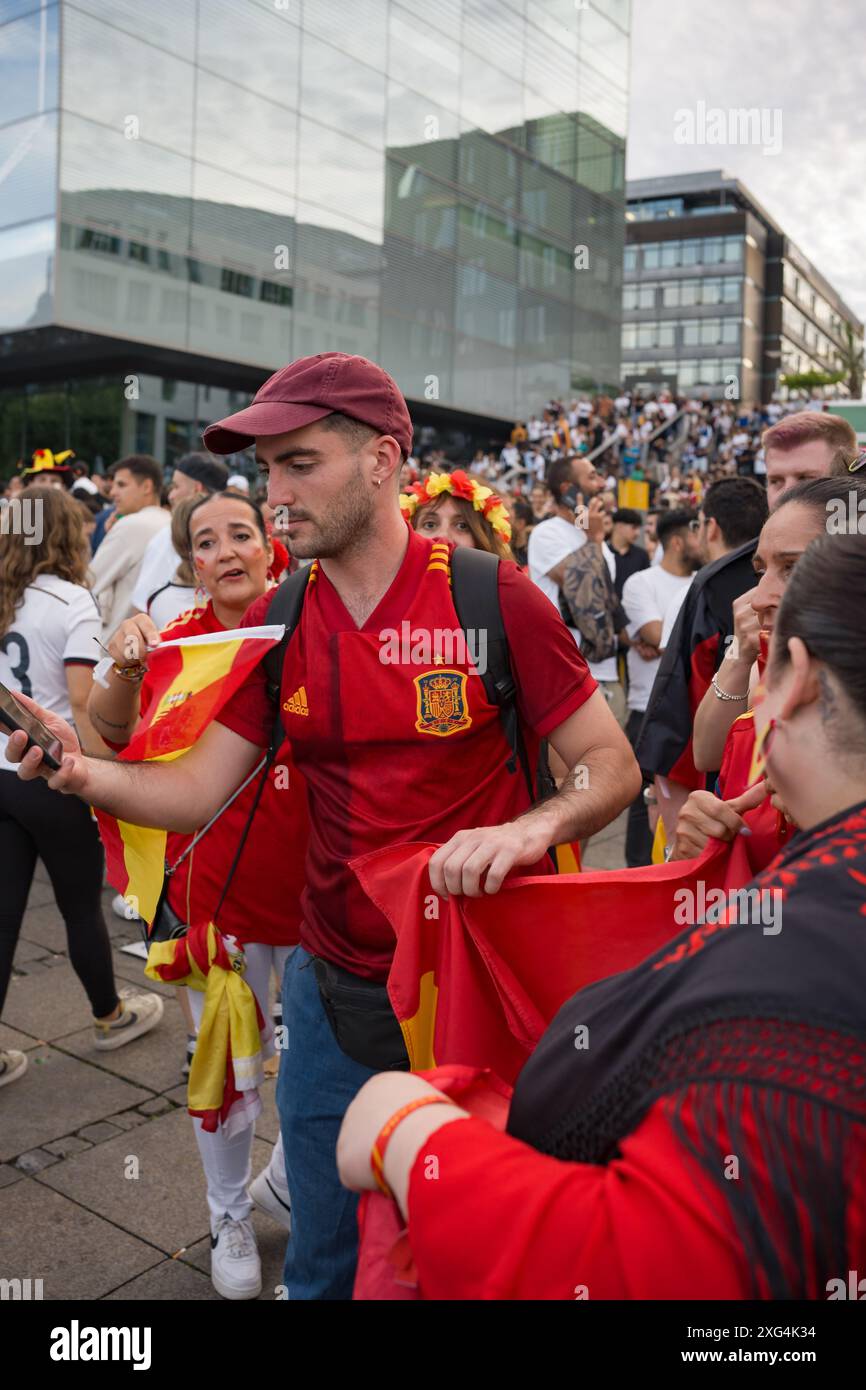 Football fans of the Spanish national team. A fan calls his friends to ...