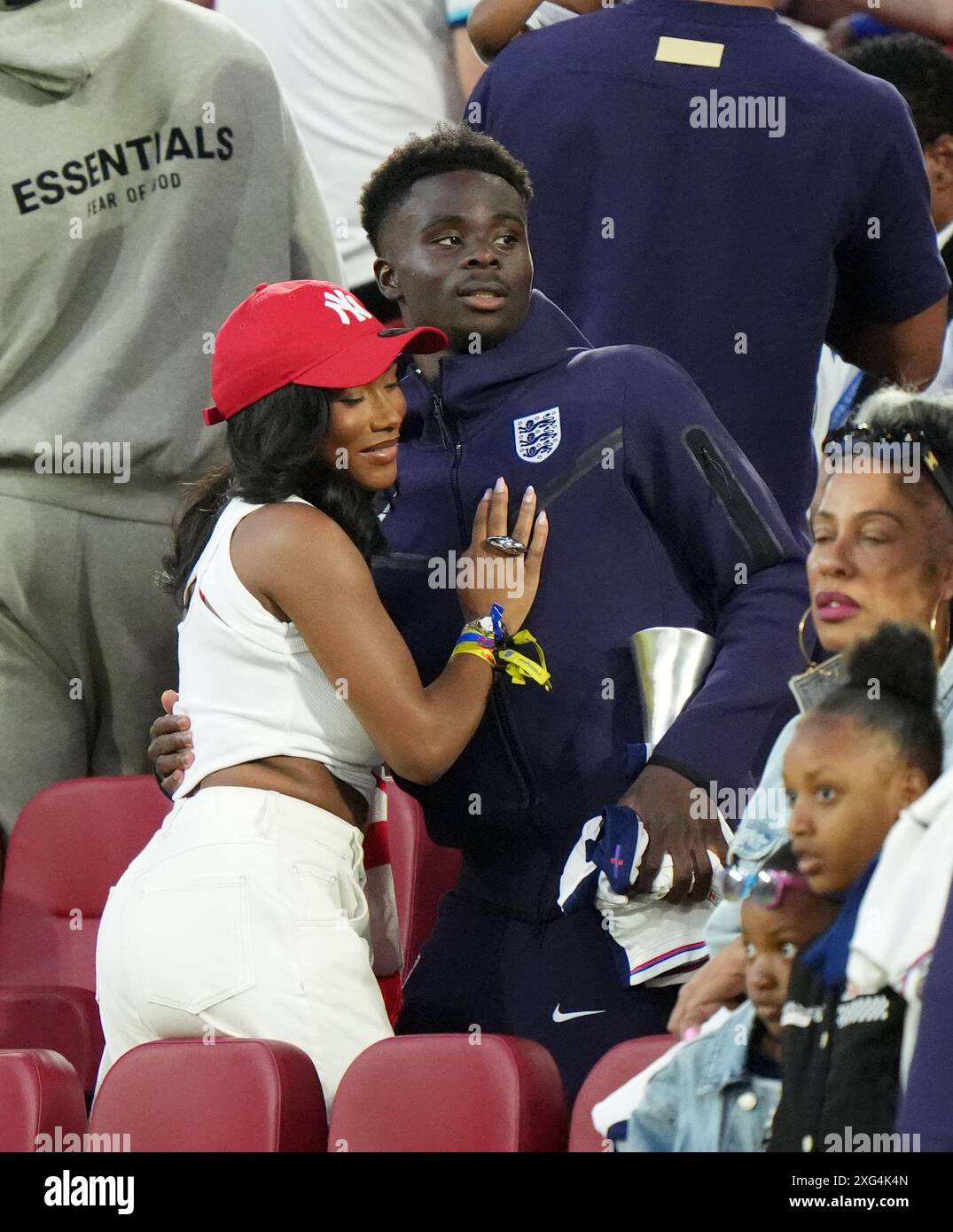 England's Bukayo Saka with his partner Tolami Benson after the UEFA ...