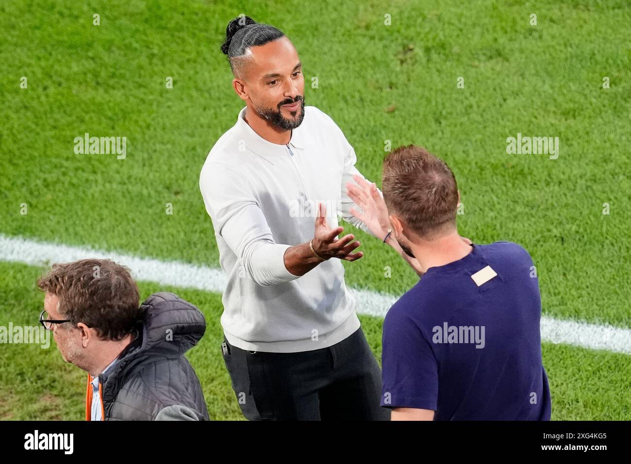 England's Harry Kane (right) with former footballer Theo Walcott after ...