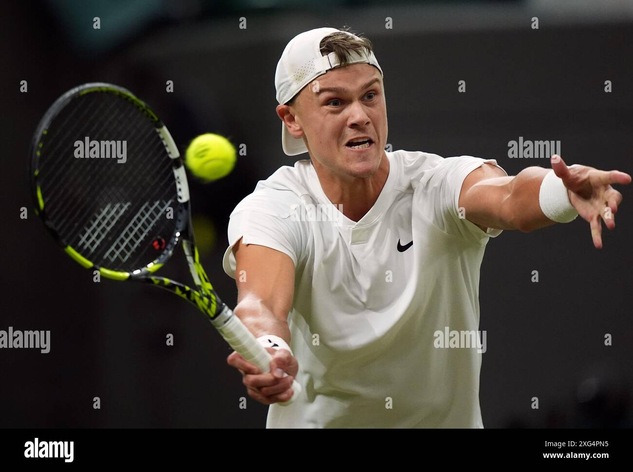 Holger Rune in action against Quentin Halys (not pictured) on day six ...