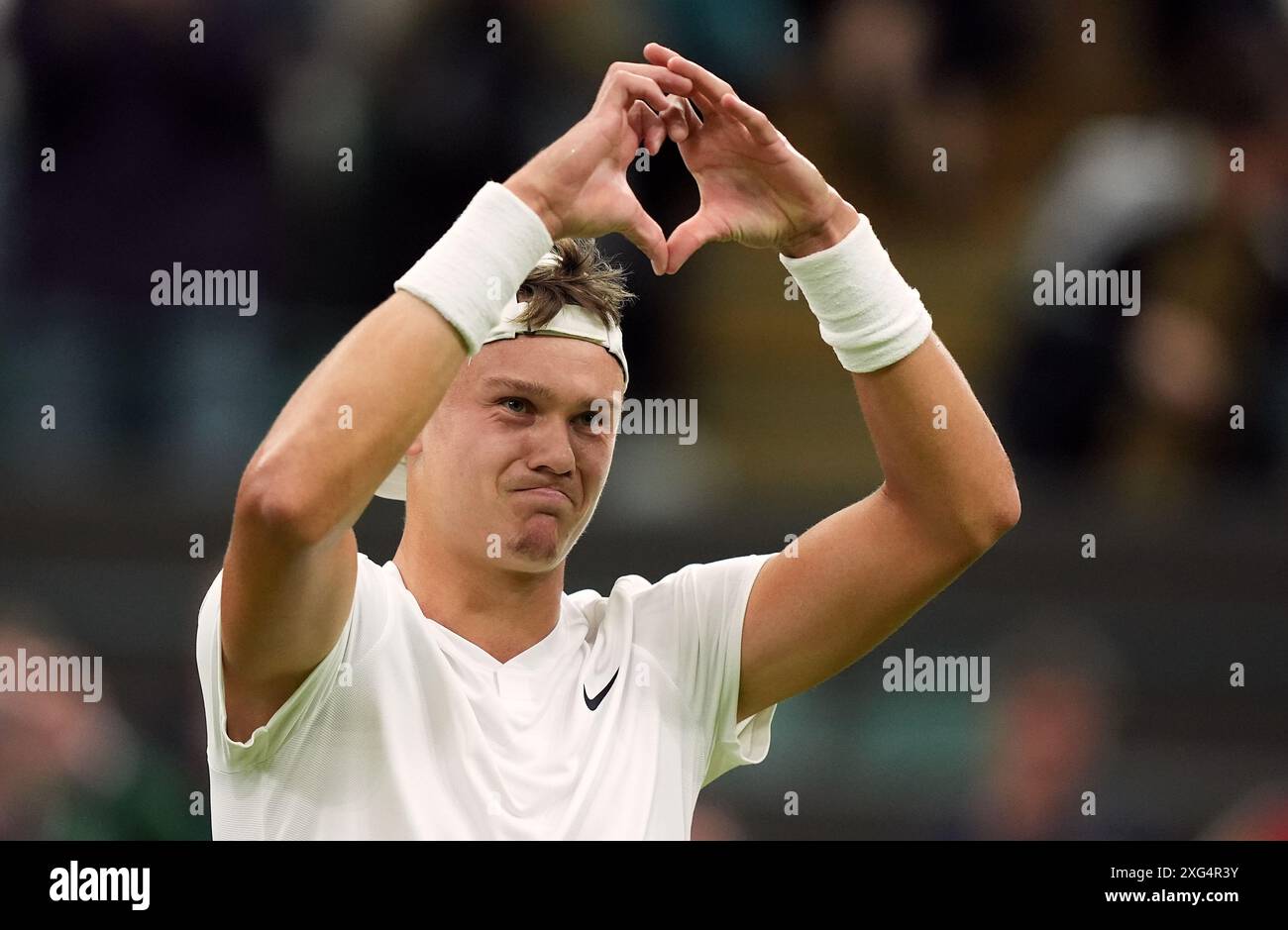 Holger Rune celebrates beating Quentin Halys (not pictured) on day six ...