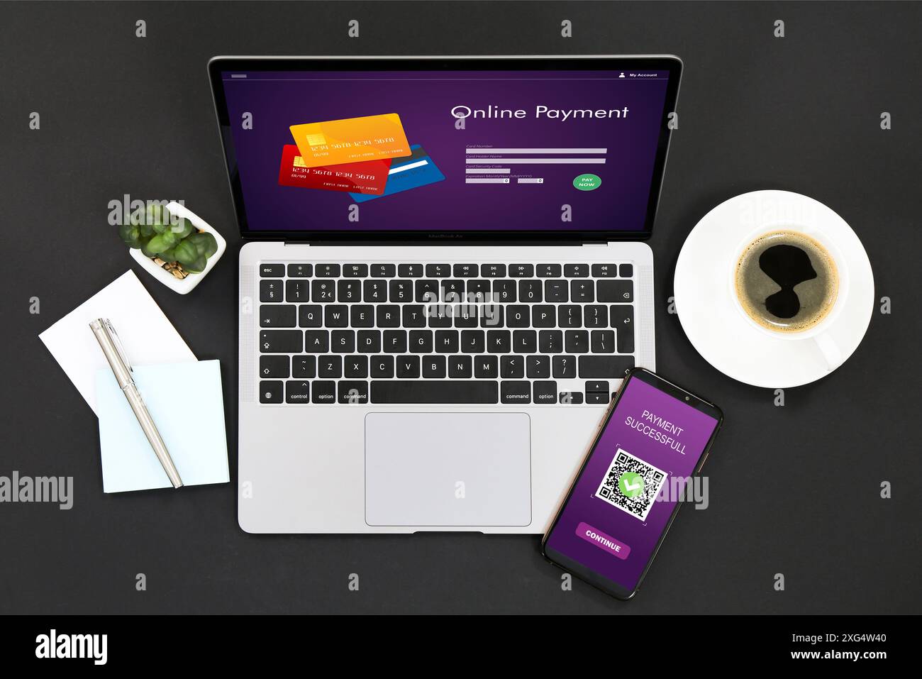 Online payment system. Laptop and smartphone with open application on ...