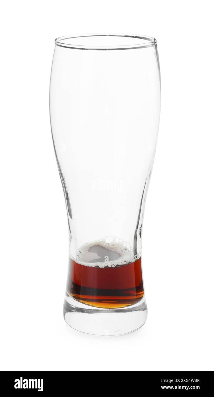 Almost empty glass of beer isolated on white Stock Photo - Alamy