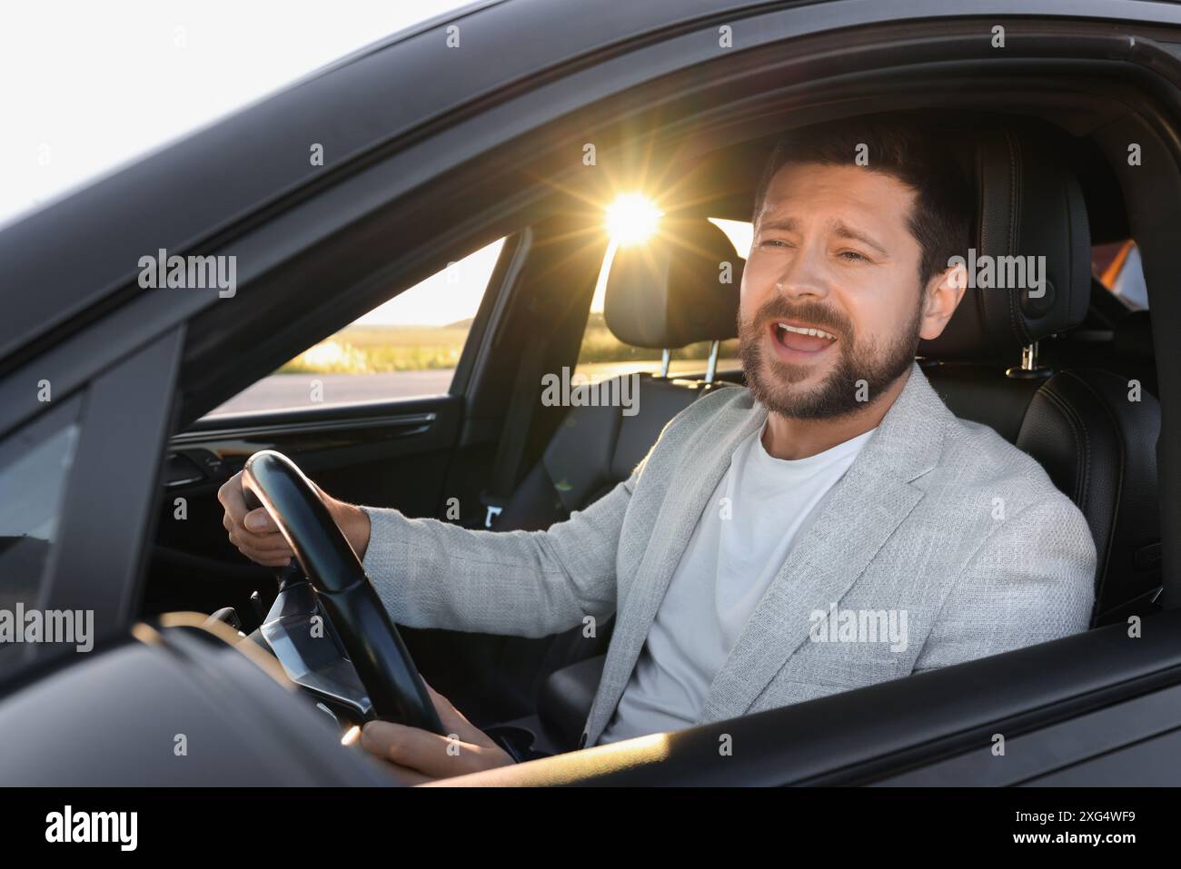 Man singing driving car hi-res stock photography and images - Alamy