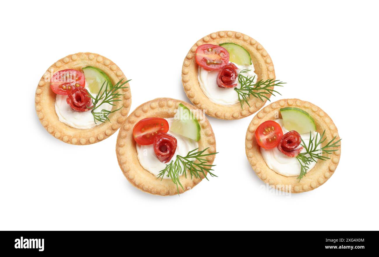 Delicious canapes with dry smoked sausages, cream cheese and vegetables ...