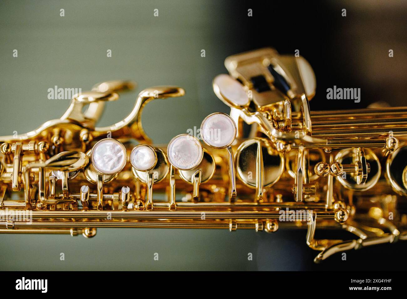 A close-up of a golden saxophone with intricate details and mother-of ...