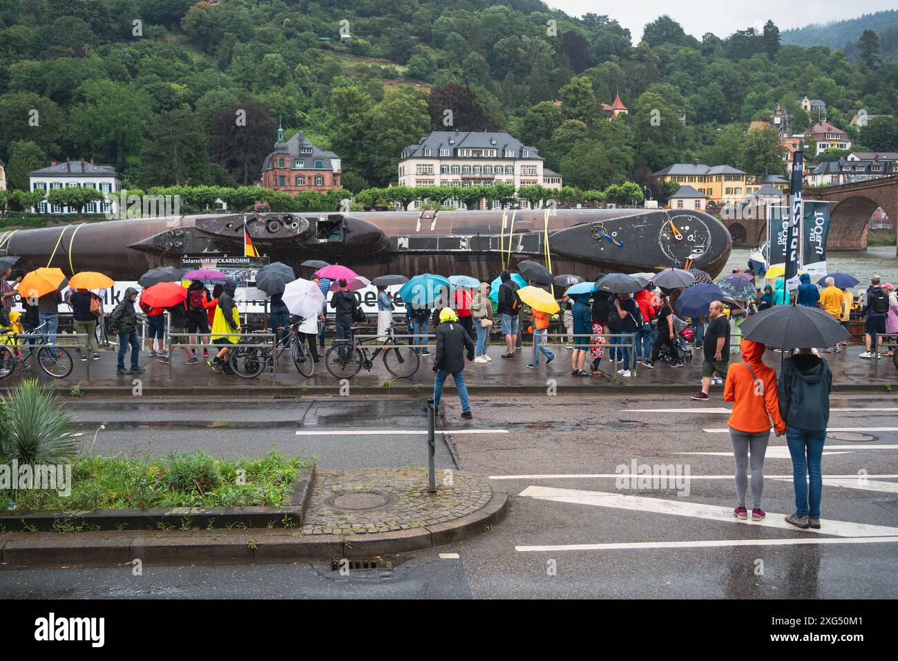 Speyer, Germany. 6th July, 2024. Spectators standing in the rain with ...