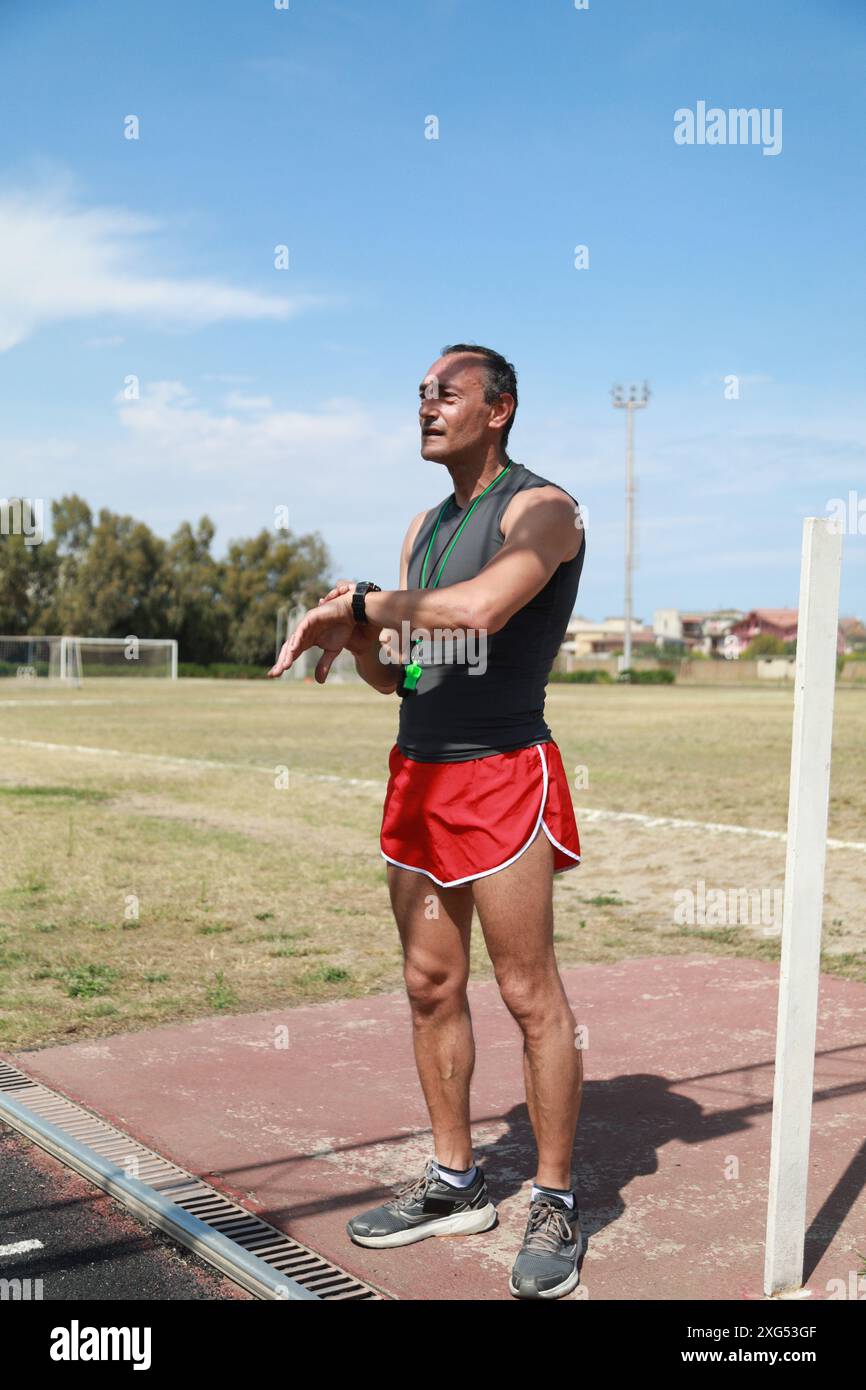 Coach Checking Time On His Smartwatch Stock Photo - Alamy