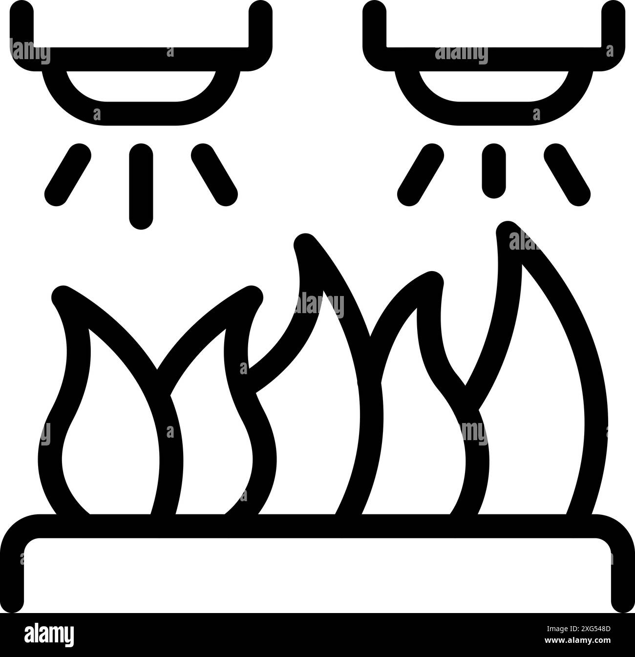 Fire sprinkler system is spraying water over burning grass to ...