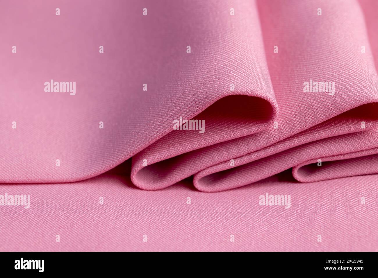 pink cotton material close-up, a piece of clothing made of pink fabric ...