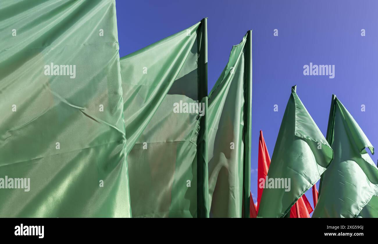 green flags set up during the celebration in windy weather, flags ...