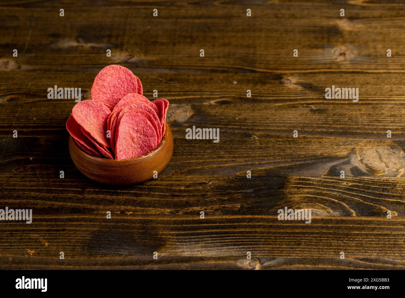 red potato chips with meat flavor, adding red dye to potato chips Stock ...