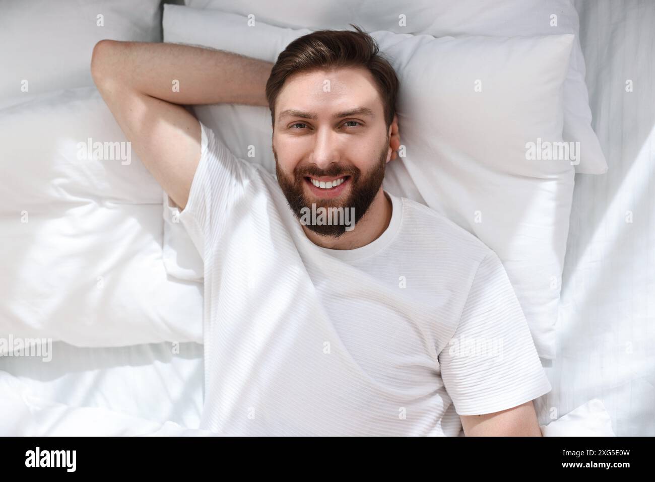 Man sleeping alone bed smiling hi-res stock photography and images - Alamy