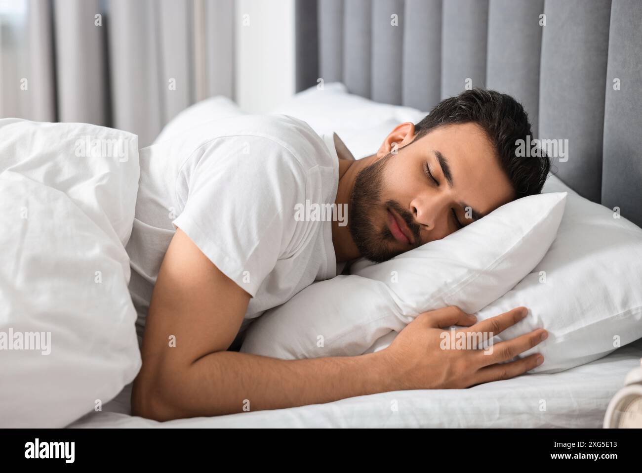 Man sleeping in bed alone hi-res stock photography and images - Alamy