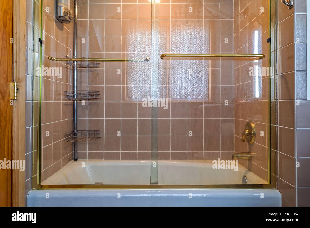 Modern bathroom shower with glass doors and tiled walls Stock Photo - Alamy