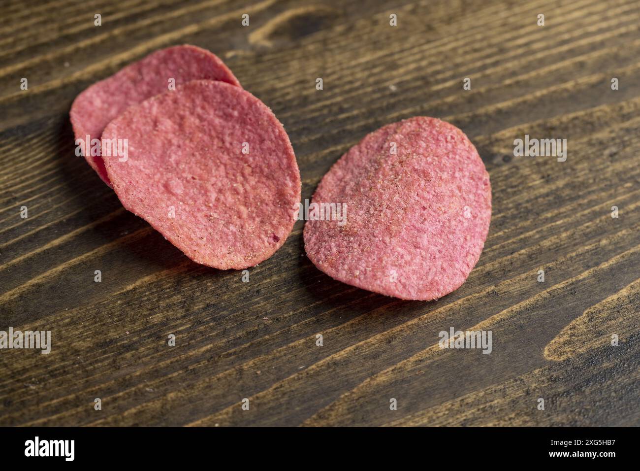 red potato chips with meat flavor, adding red dye to potato chips Stock ...