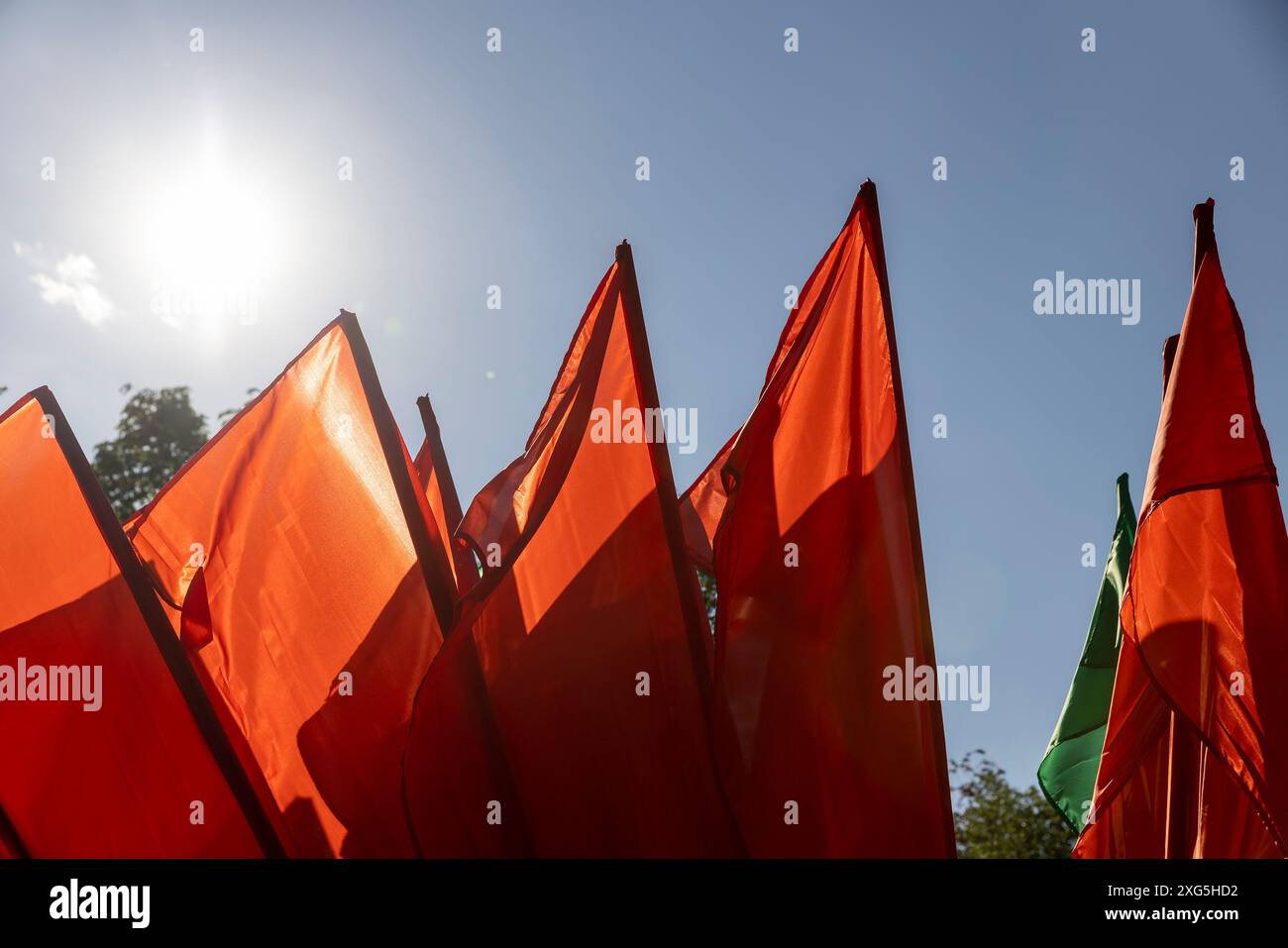 red flags set up during the celebration in windy weather, flags flutter ...