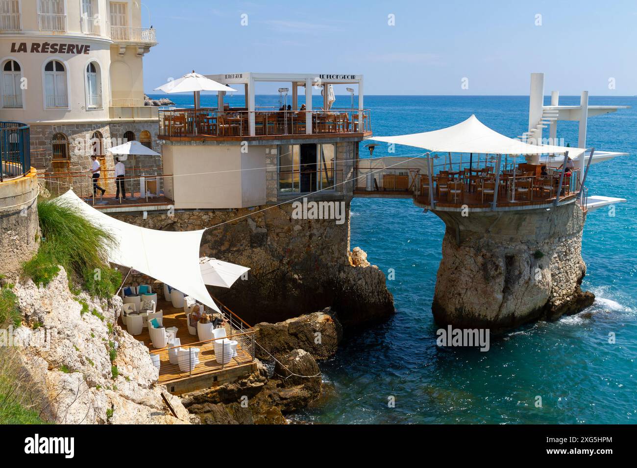 Elevated restaurant on rocks above the sea coast French Riviera Stock ...