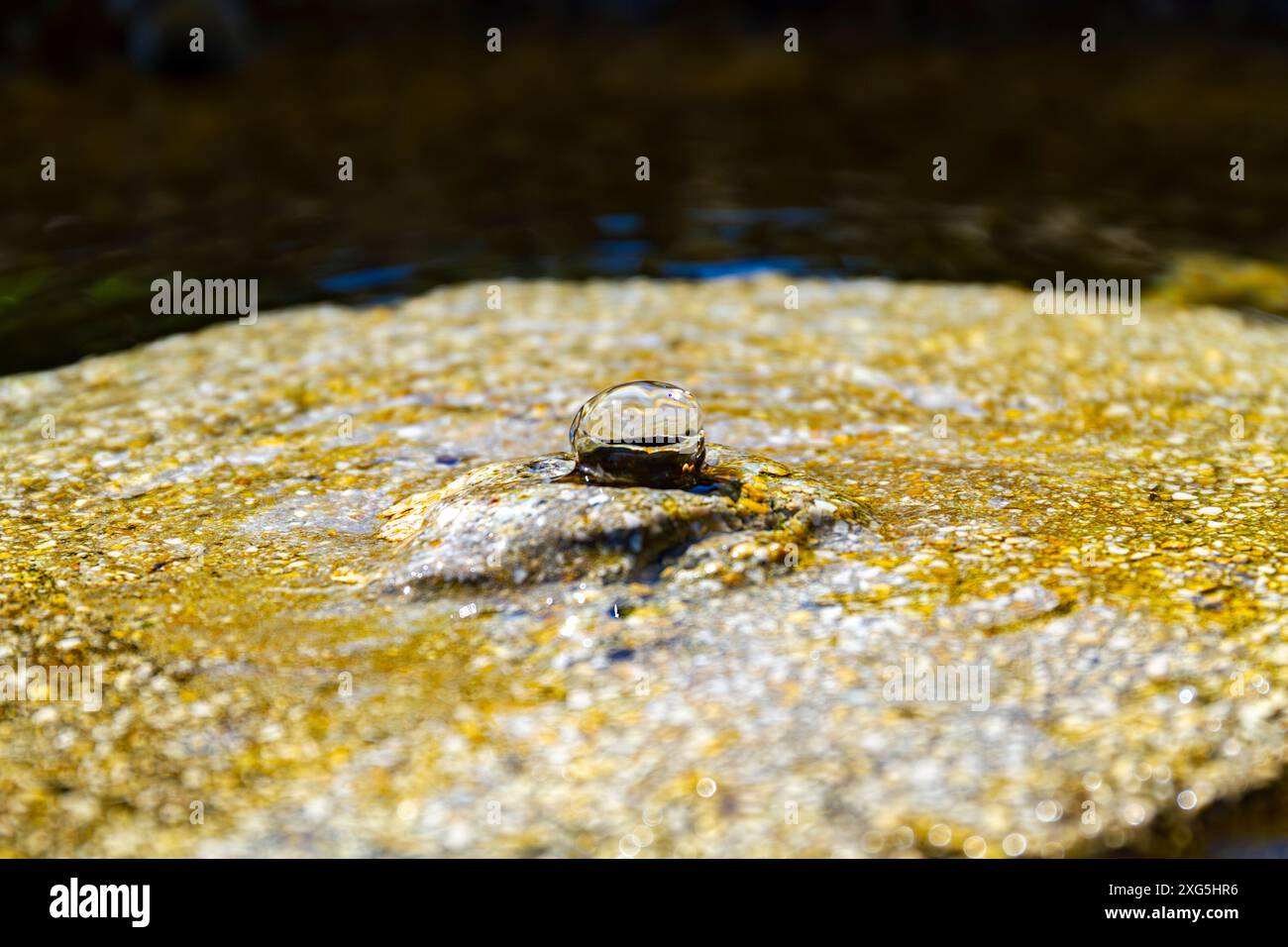 Water drop coming out of rock Stock Photo - Alamy