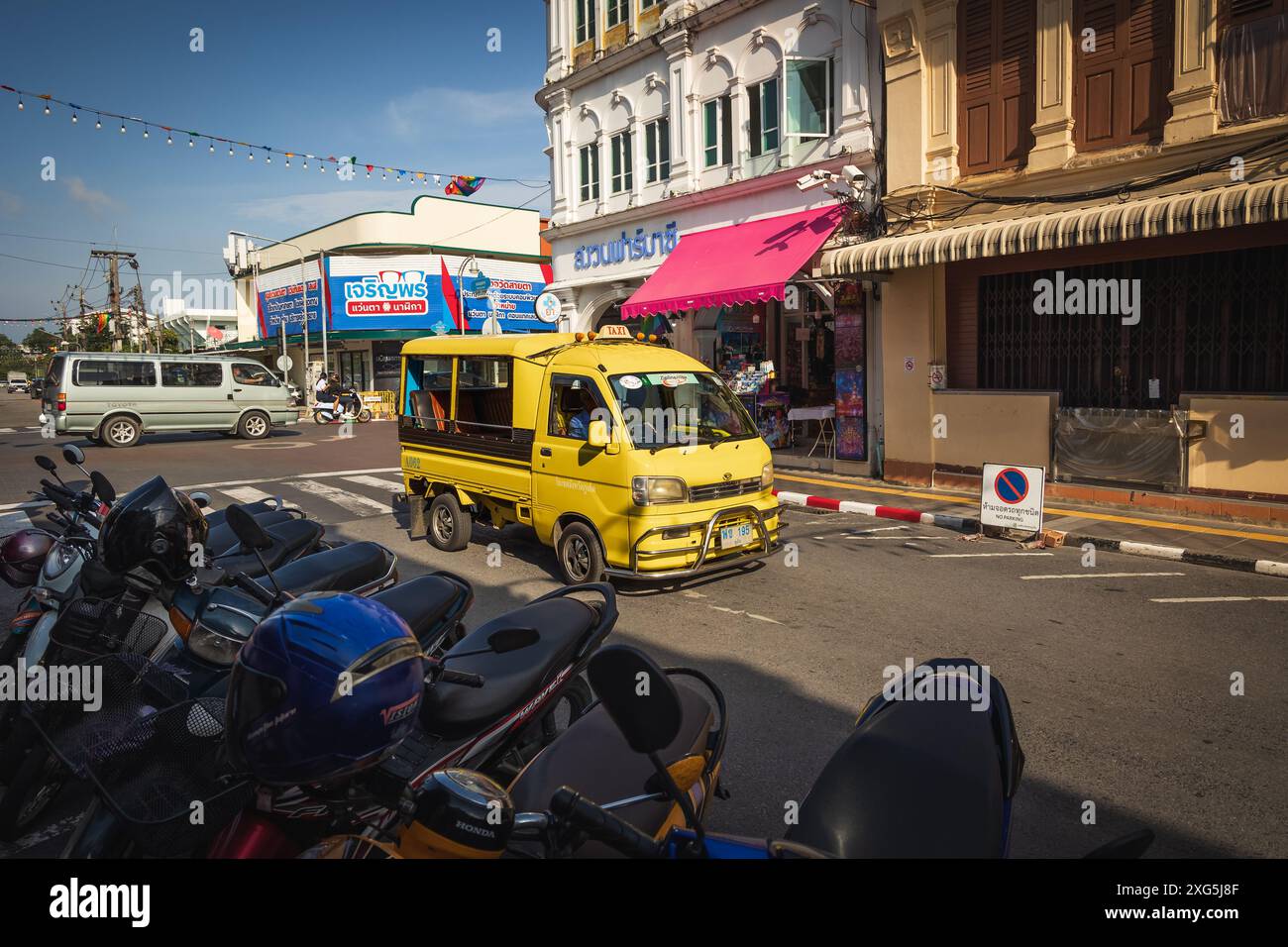 Thailand. Phuket Yellow Tuk Tuk local taxi service in old town with ...