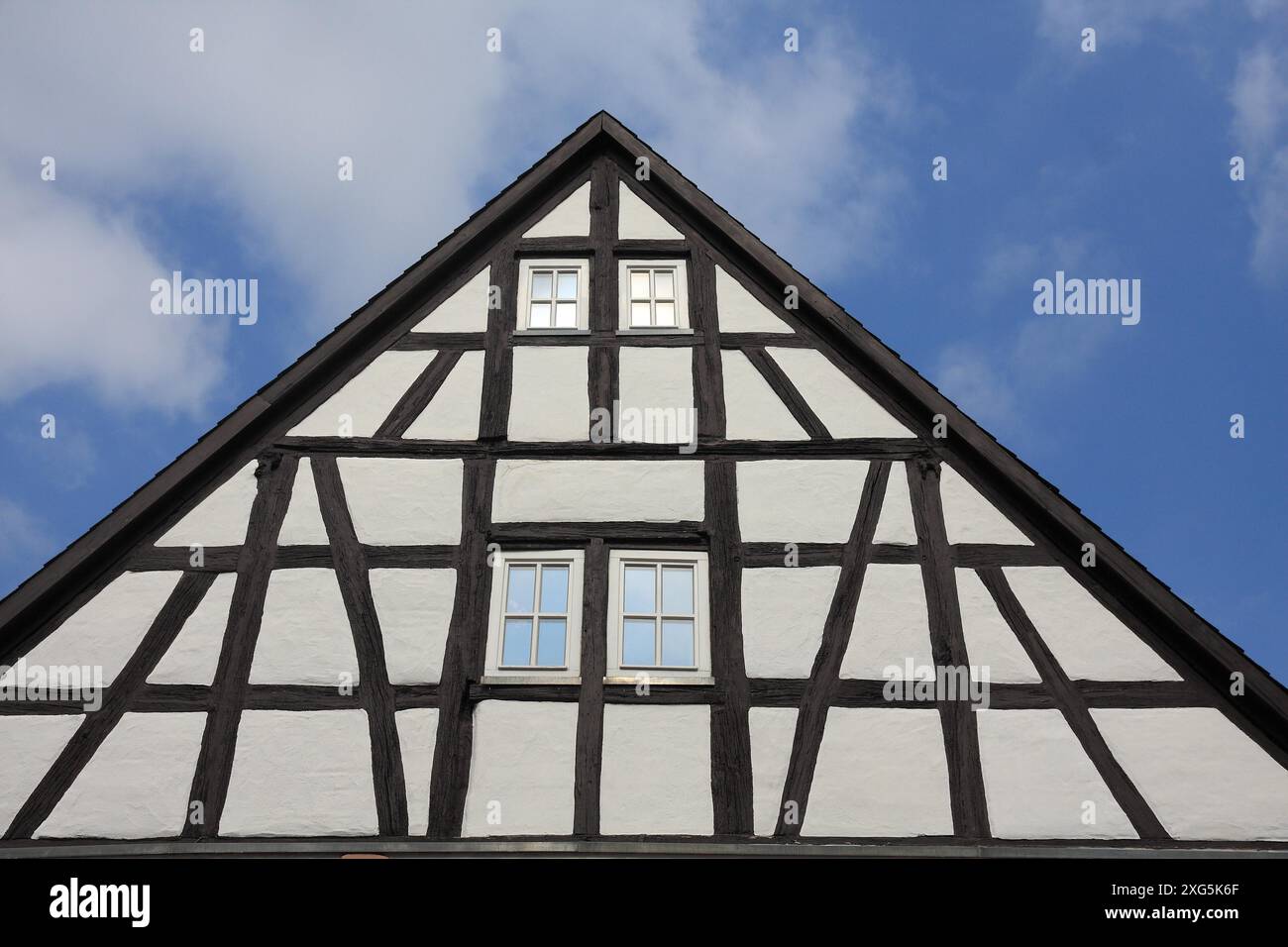 Half-timbered gable - background blue-white sky Stock Photo - Alamy