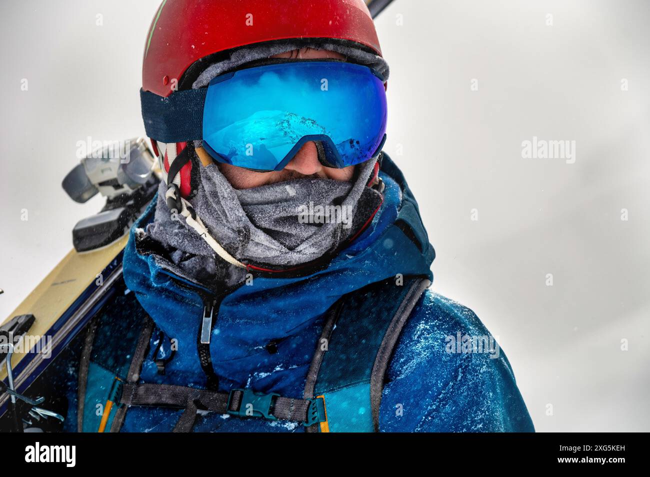 Closeup portrait of ski goggles of a man with reflection of snowy ...