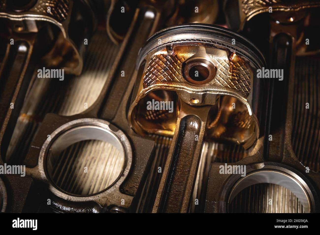 Old used engine pistons close up. Four pistons from an old disassembled ...