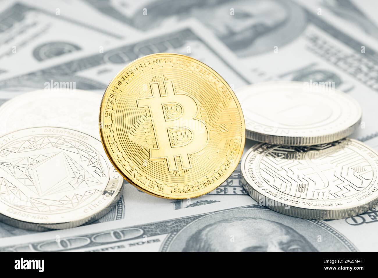 Bitcoin crypto coin on dollar banknotes. Cryptocurrency background ...