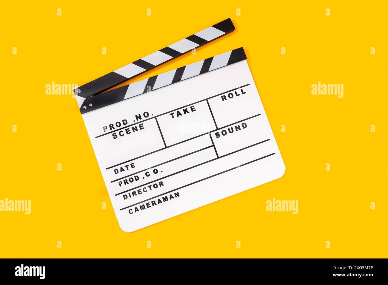 White Movie clapper board isolated on yellow background. Top view Stock ...