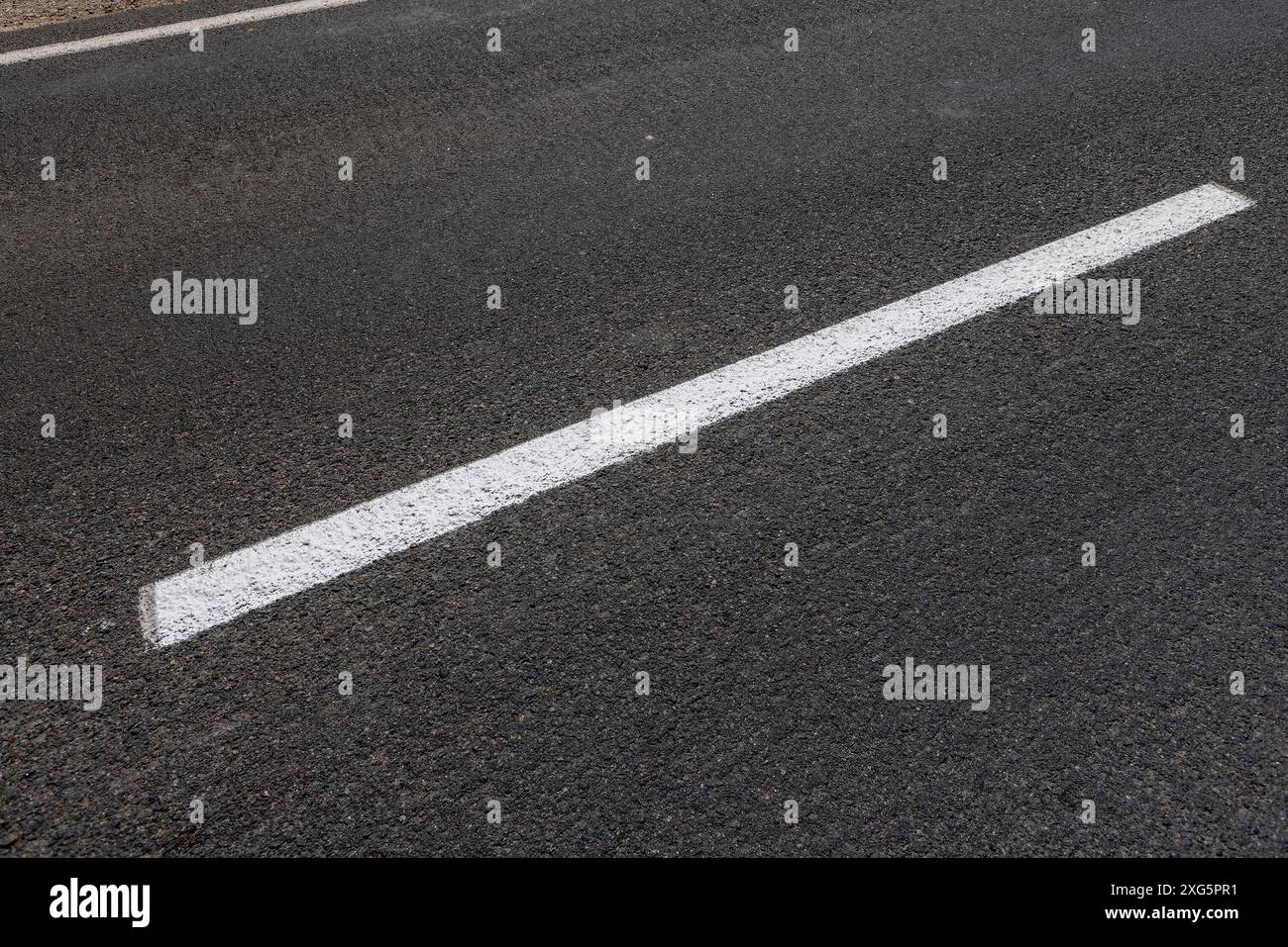 white road markings on asphalt, details of road markings on the road ...