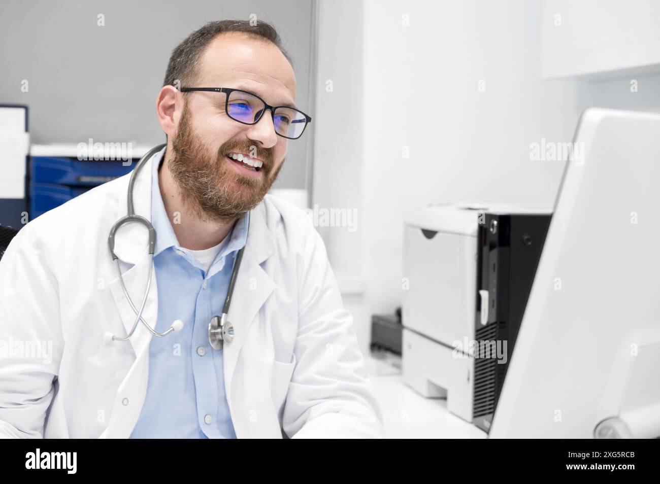 Nice friendly doctor sitting hi-res stock photography and images - Alamy