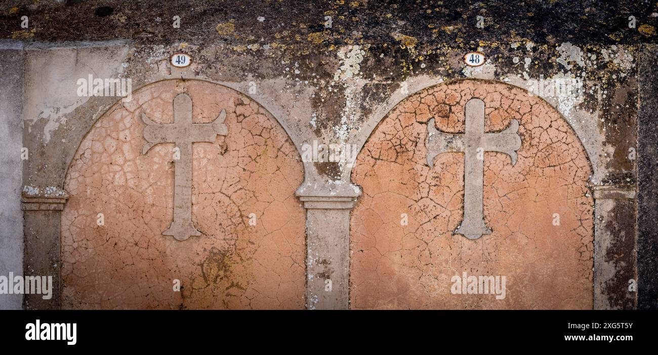 Cross on tombstone wall, Maria de la Salut cemetery, Mallorca, Balearic ...