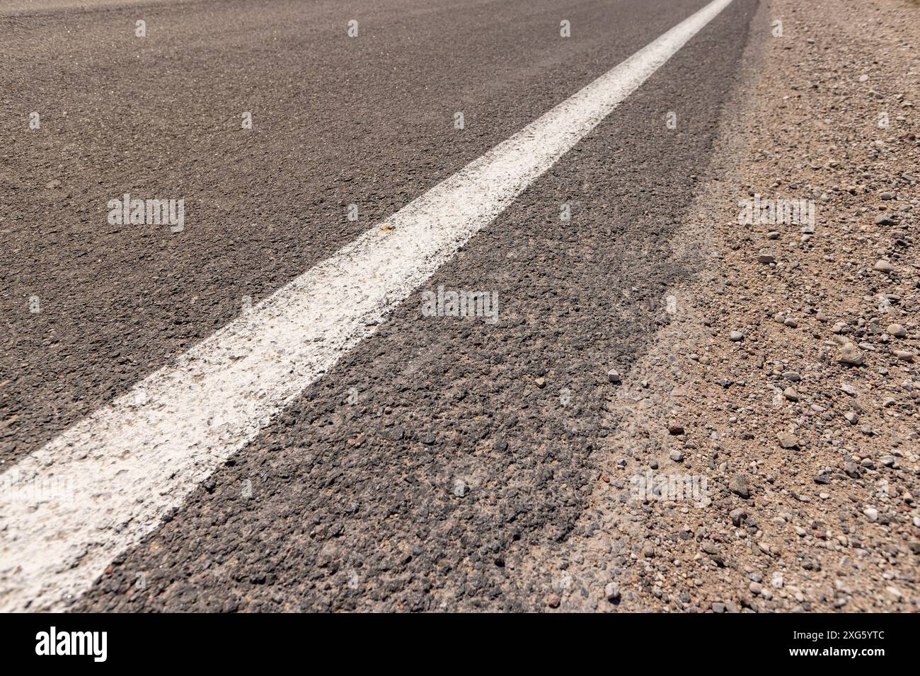white road markings on asphalt, details of road markings on the road ...