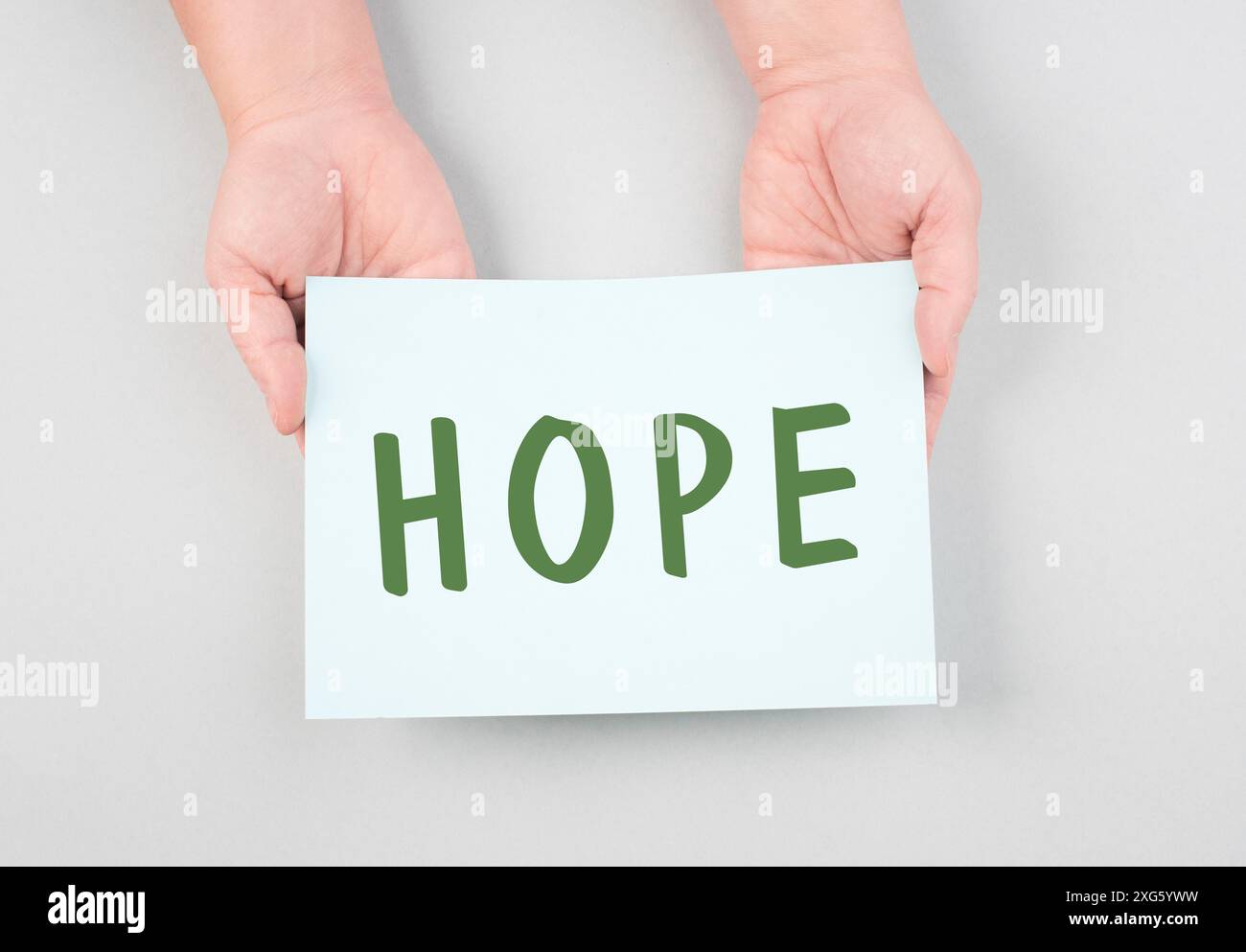 The word hope is standing on a paper, positive mindset, optimism for ...