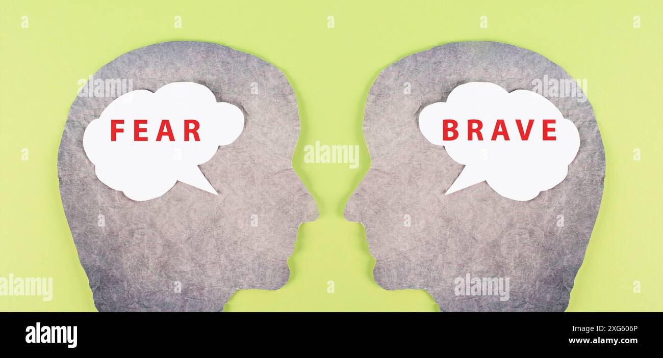 Two people look at each other, speech bubble clouds with the words fear ...