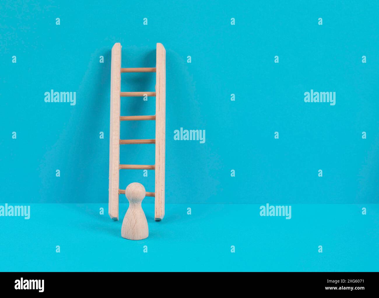 Man is standing next to a ladder, climbing up in career, having a goal ...