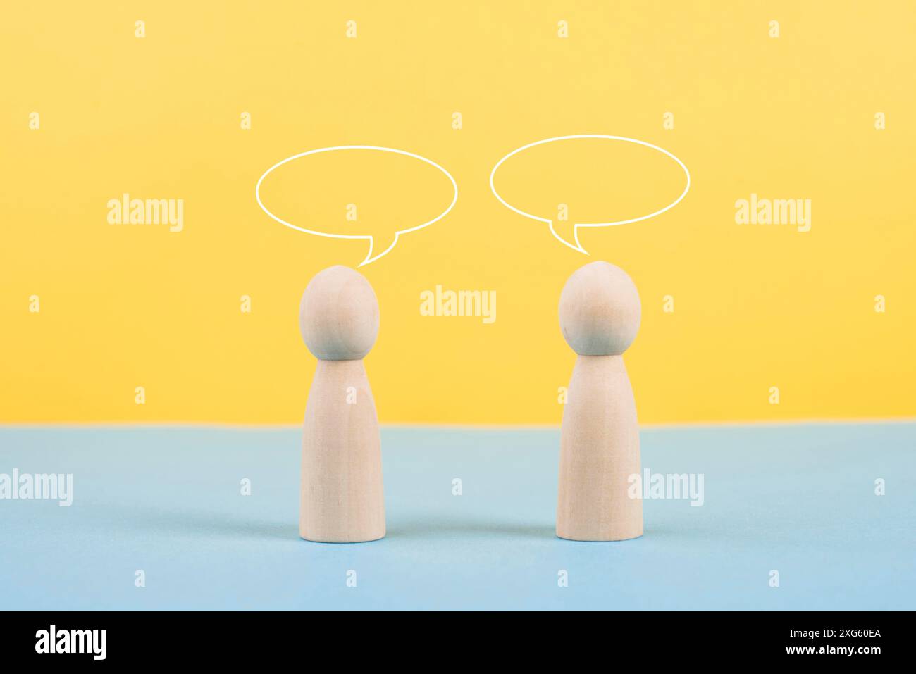 Two people talking together, empty speech bubbles, having a ...