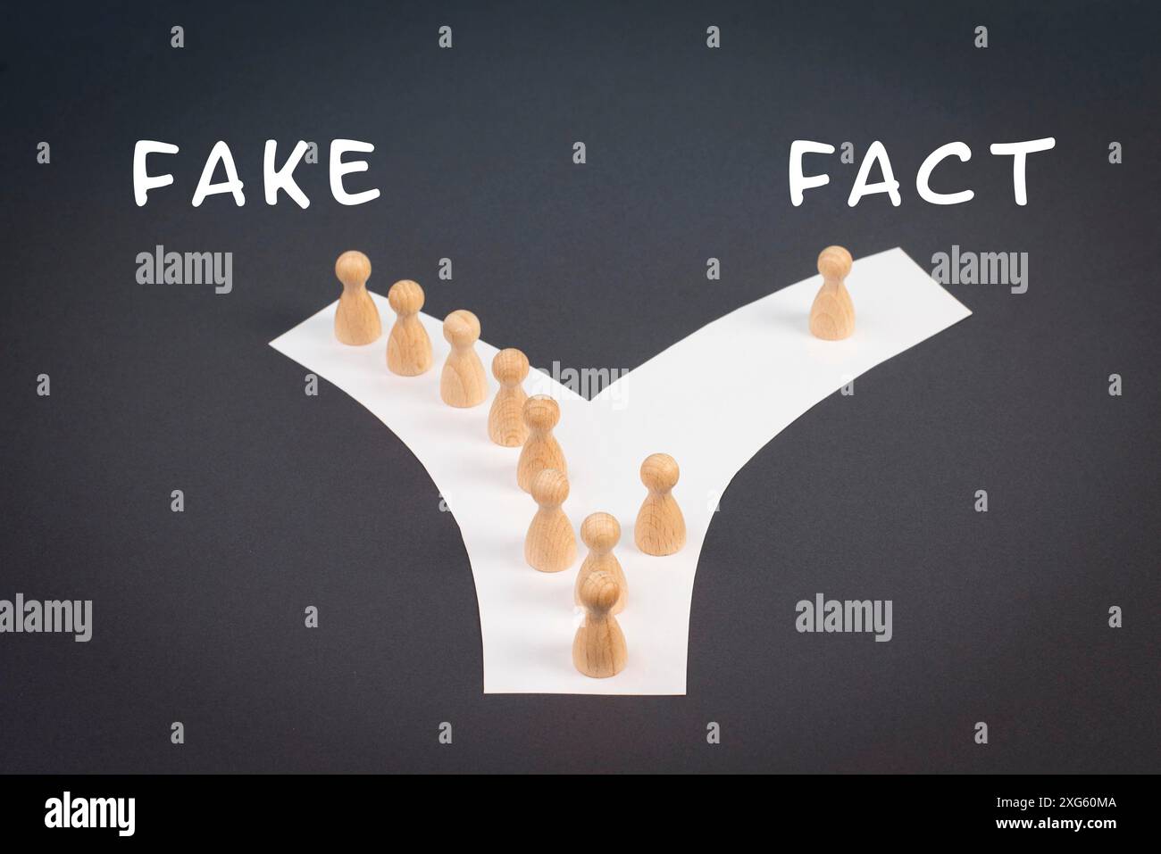 Crowd of people follow the path to the fake information, one thinks ...