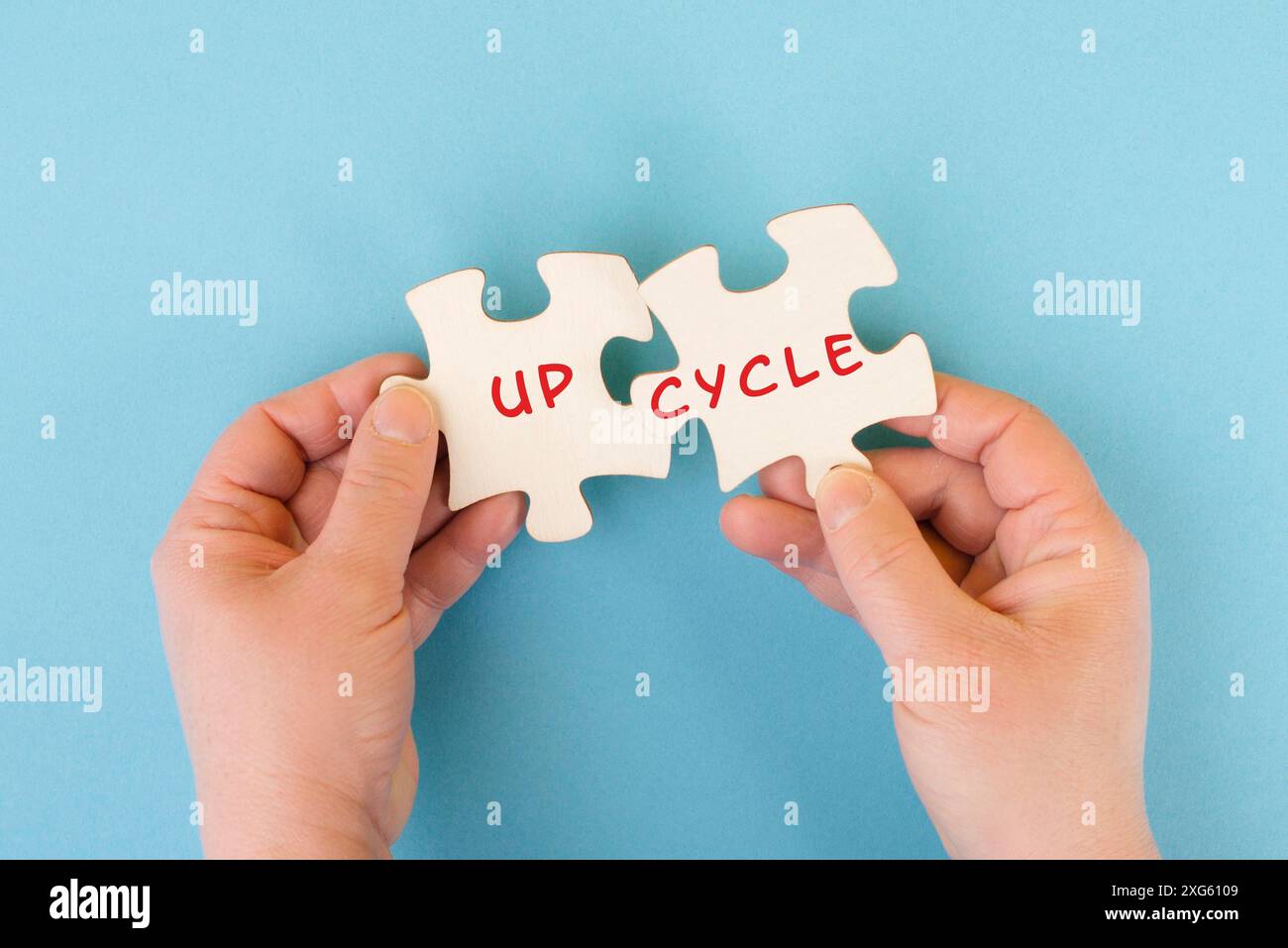 The word up cycle is standing on puzzle pieces, environmental ...