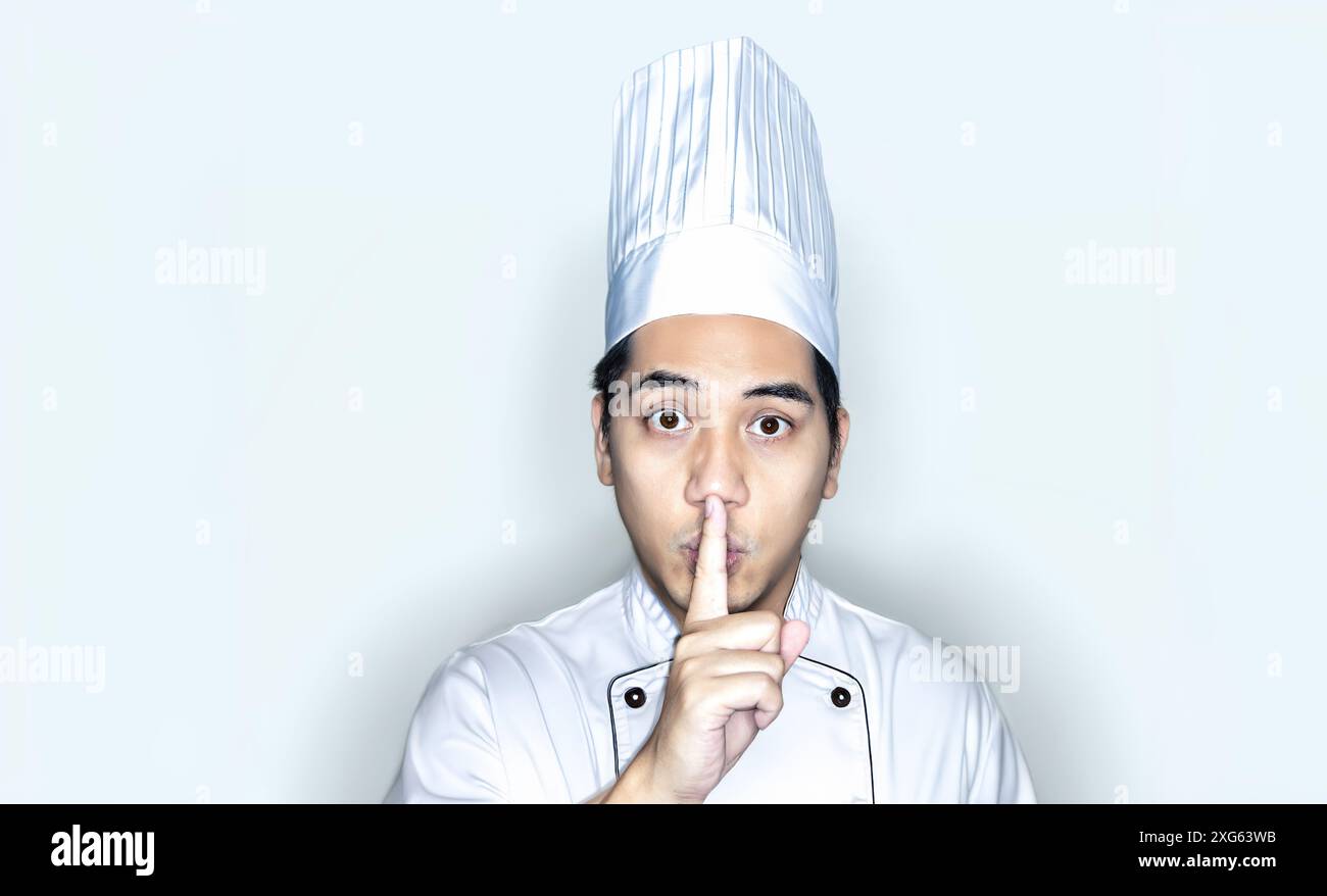 Asian chef keeping secret Asian model using finger language signs on ...