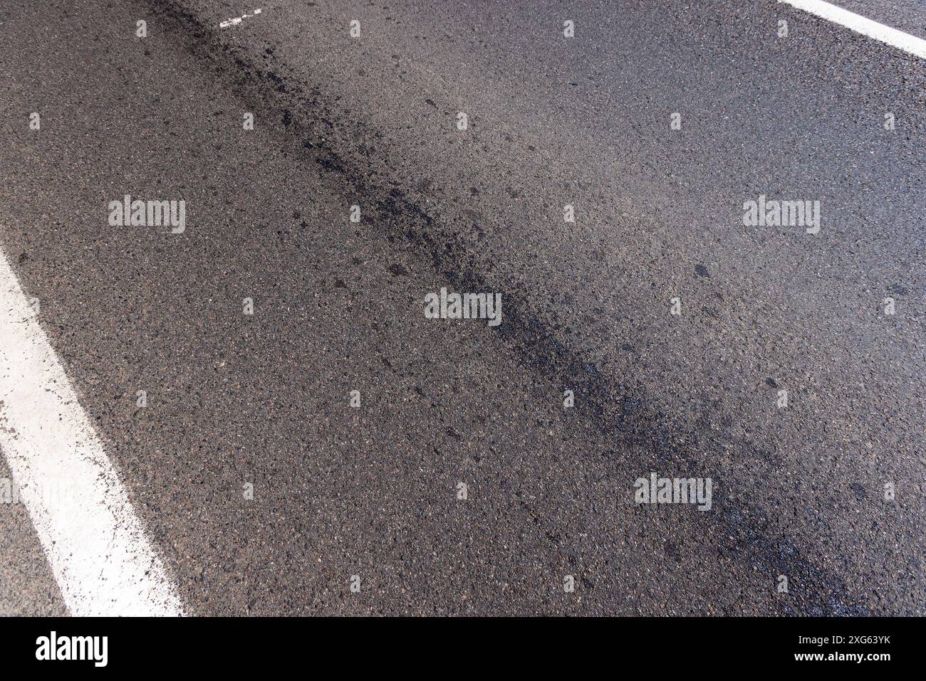 white road markings on asphalt, details of road markings on the road ...