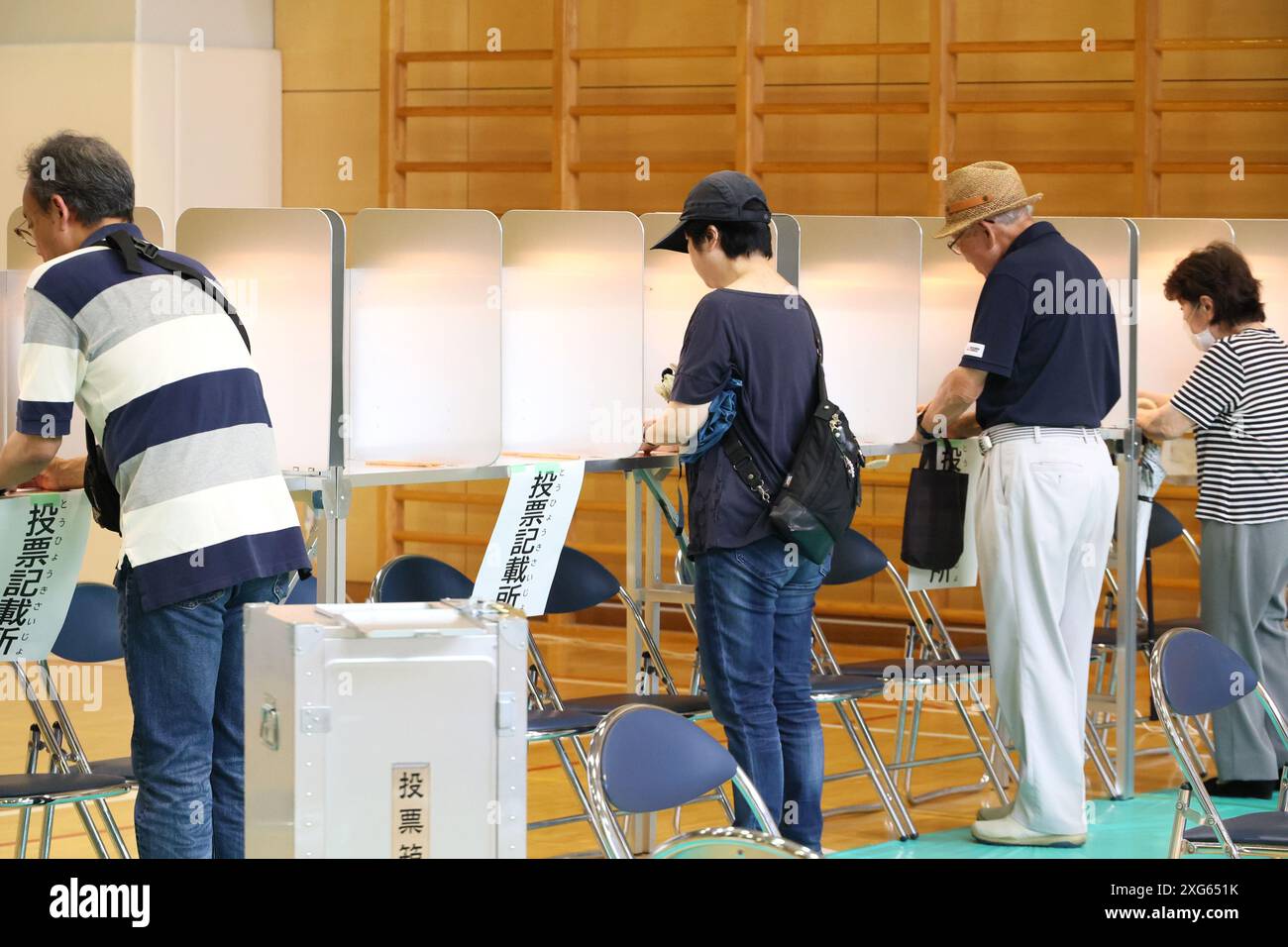 Tokyo, Japan. 7th July, 2024. Voters fill in ballot papers for the ...